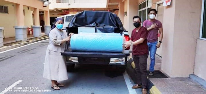 Frontliners receive a booster from Franciscan nuns | Catholic Sabah